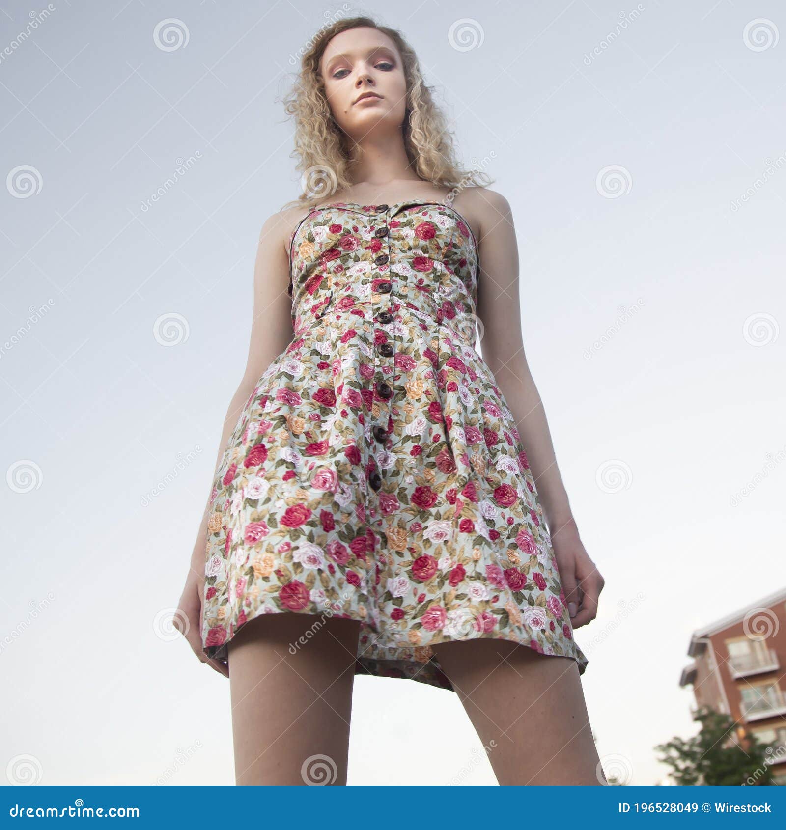 Low Angle Shot of a Young Attractive Female Posing at Camera Stock ...