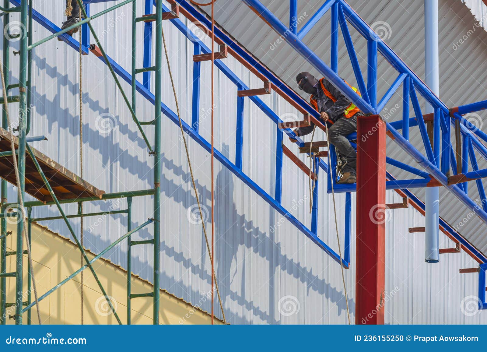 Low Angle and Side View of Construction Workers are Lifting Metal ...