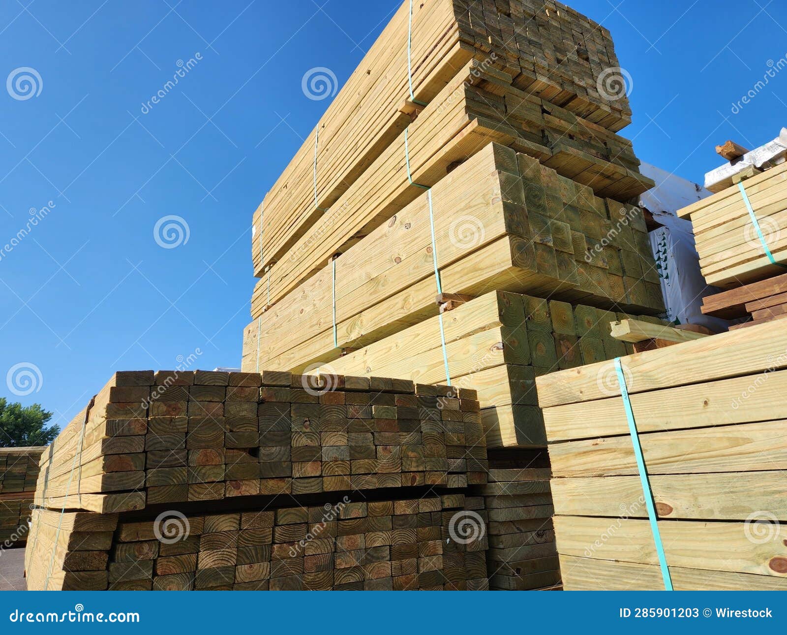 Low Angle of a Stack of Lumber with a Clear Blue Sky Above Stock Image ...