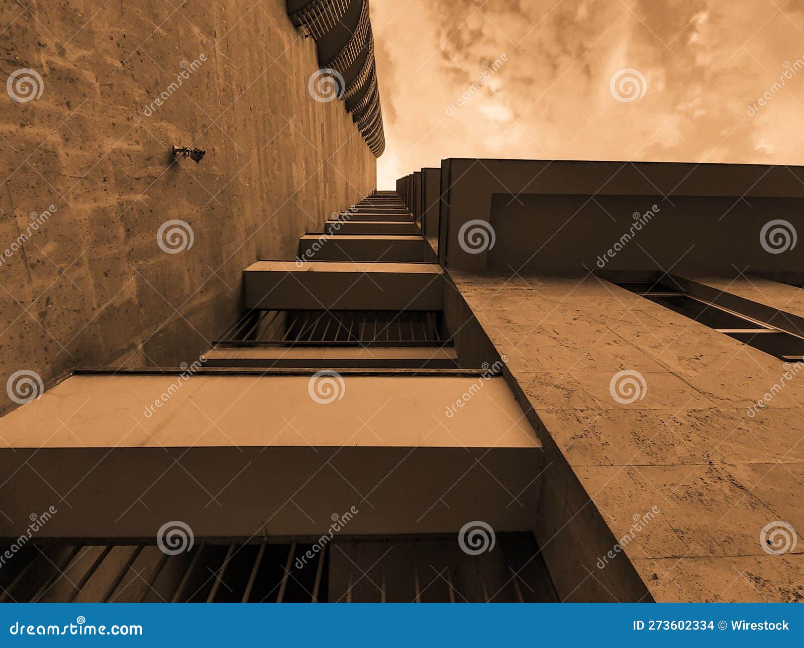 Low Angle of a Stone High-rise Building with Clouds in the Background ...