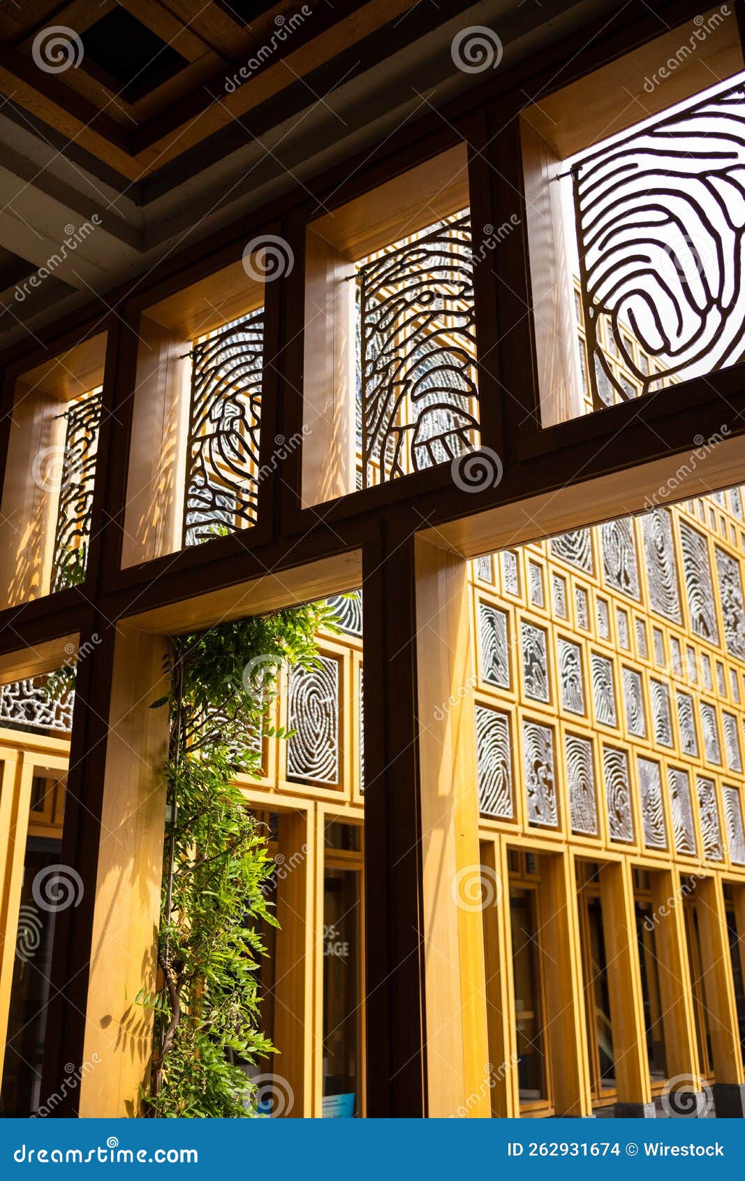 Low-angle Vertical Shot of Wooden Windows with Intricate Designs Stock ...