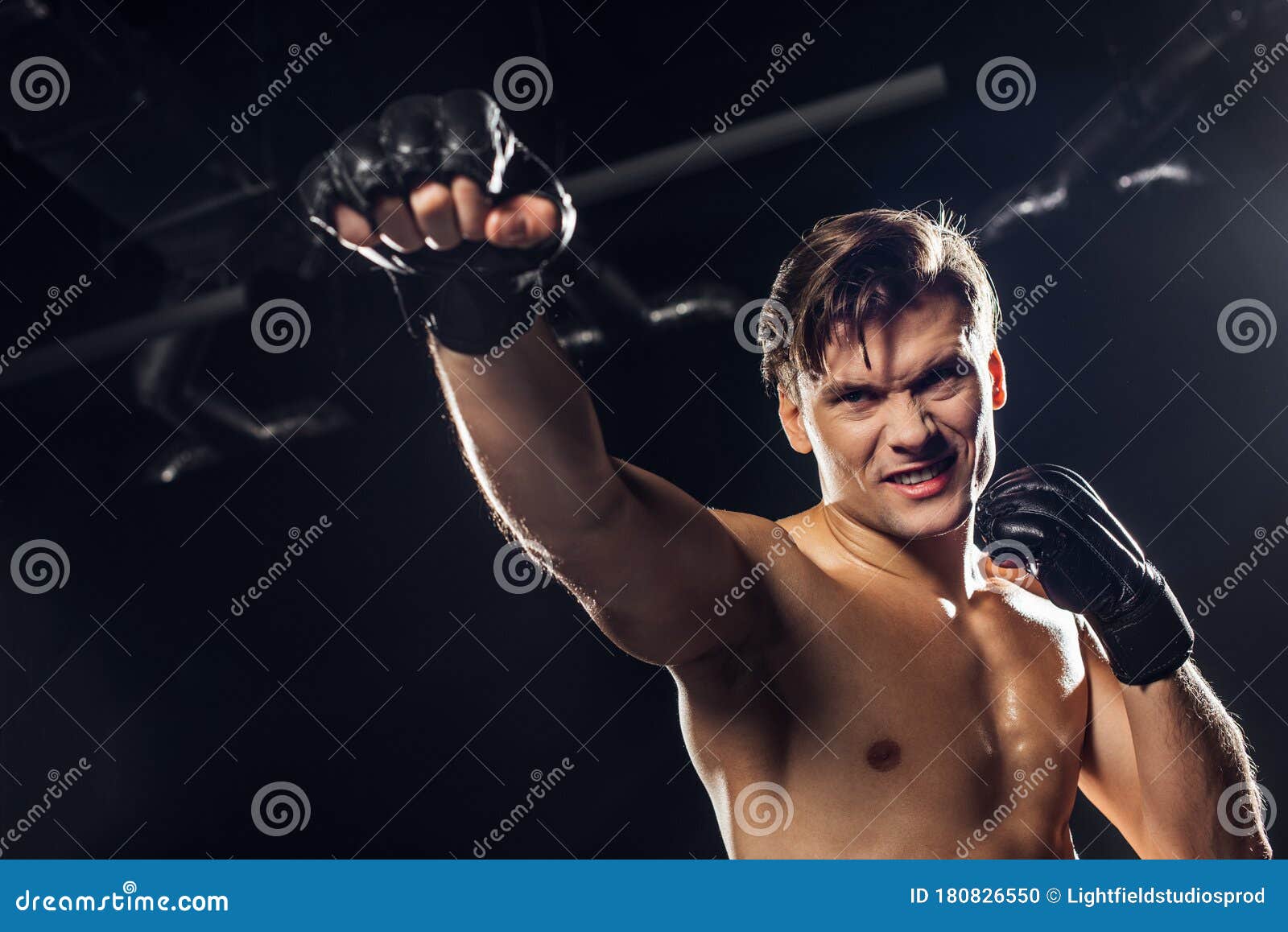 Low Angle View of Angry Boxer in Gloves Looking Away. Stock Photo ...