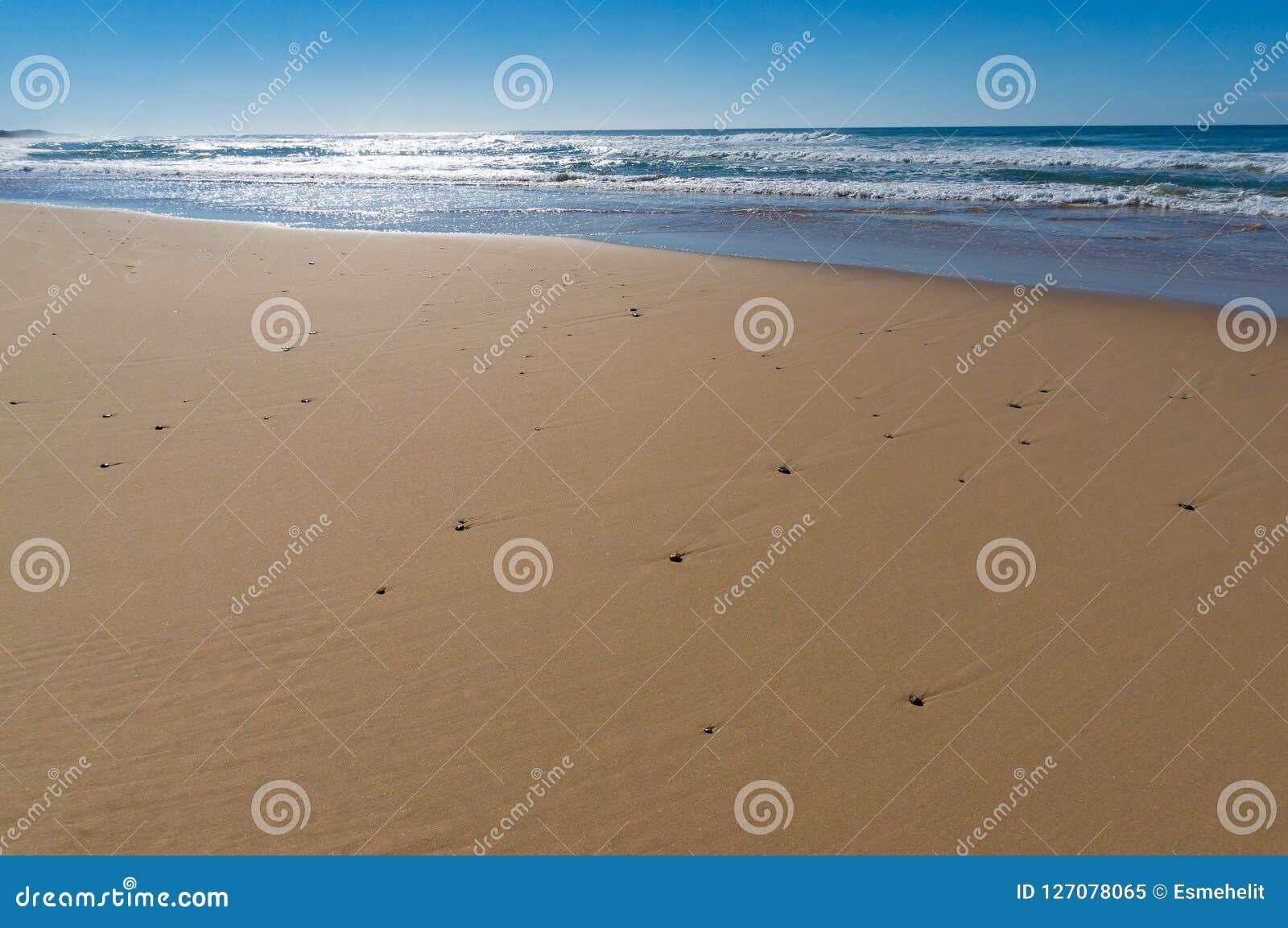 Low Angle View of Beach Sand with Pebbles and Mild Waves Stock Image ...