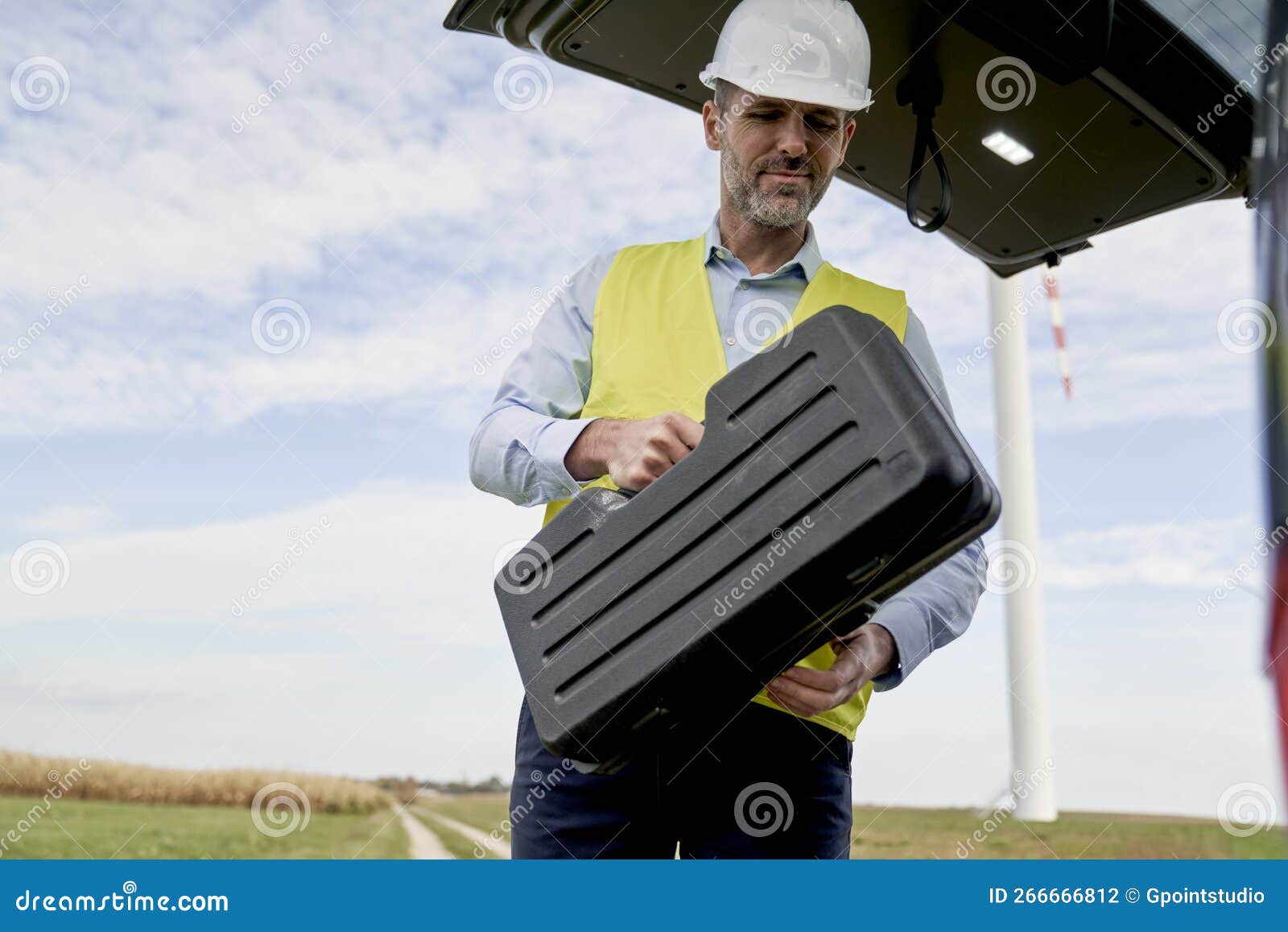 Caucasian Maintenance Engineer Taking a Tool Box Out of the Car Stock ...