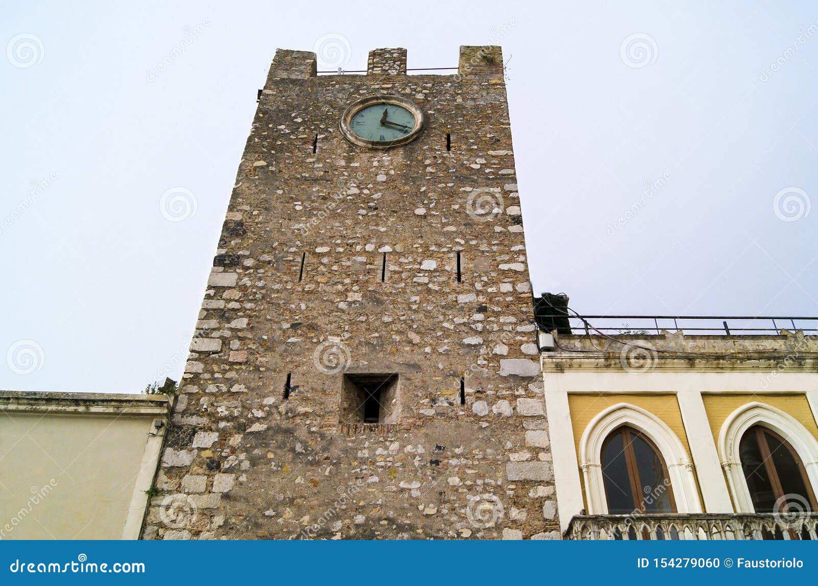 Low Angle View of the Clock Tower in the Square 9th April in Taormina ...