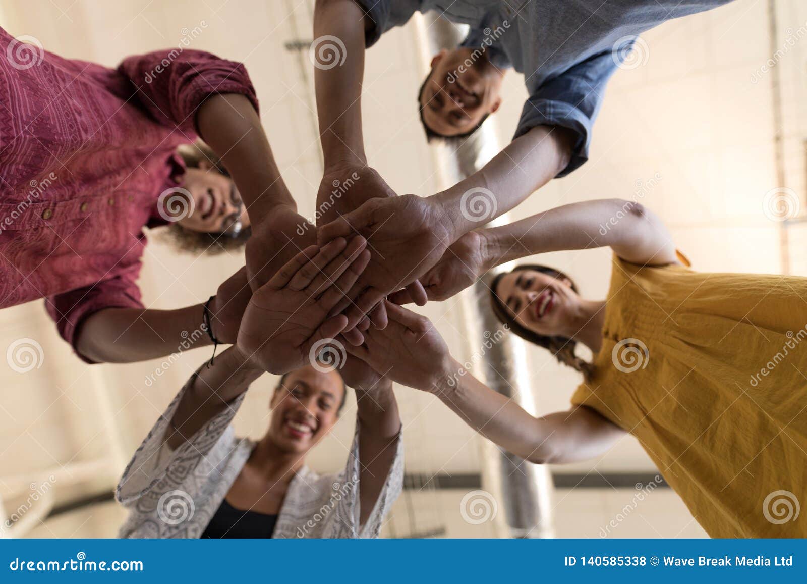 Business Colleagues Forming Hand Stack in Office Stock Photo - Image of ...