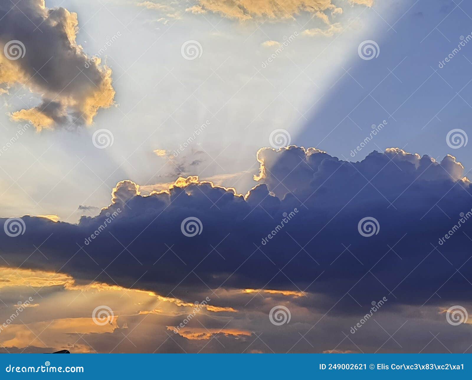 Low Angle View of Dramatic Sky during Sunset, Sunbeams through Clouds ...