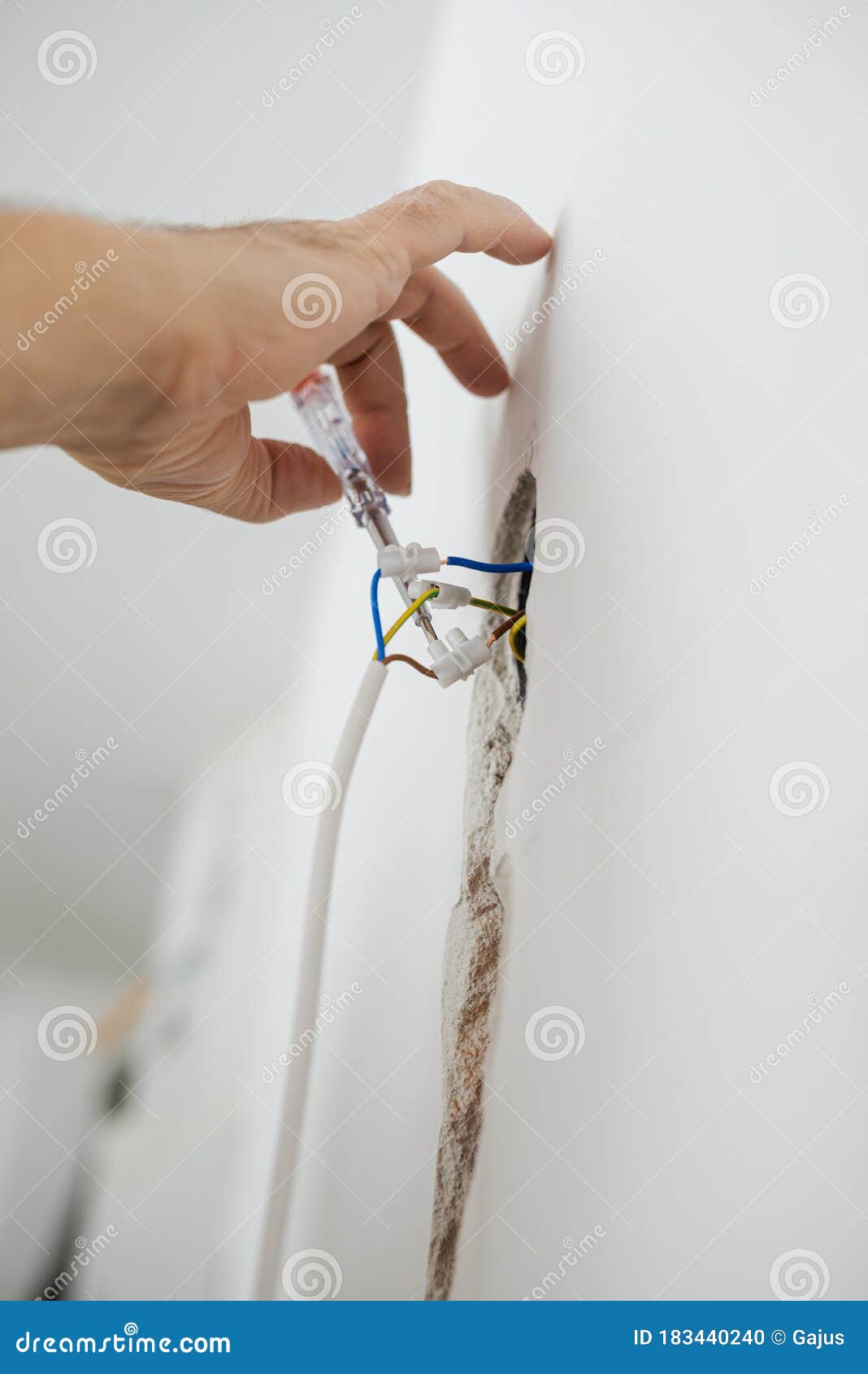 Electrician checking wires stock photo. Image of technician - 183440240