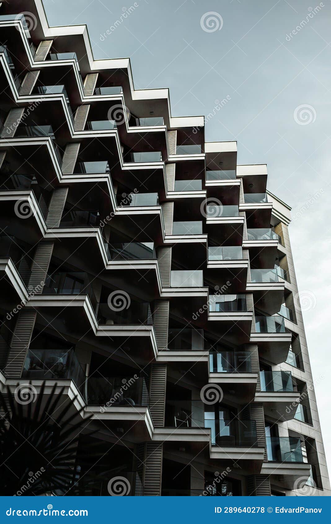 Facade Of Building, With Triangular Balconies With Glass Railings ...