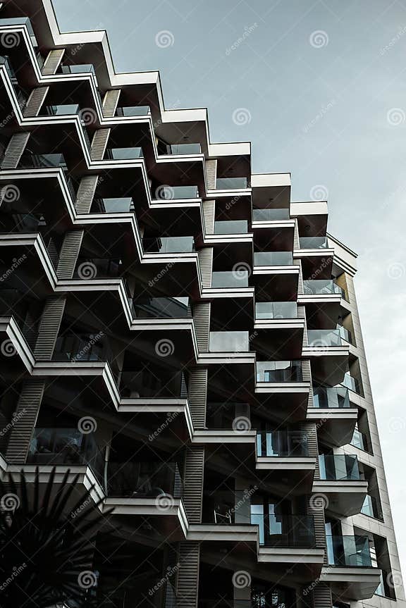 Facade of Building, with Triangular Balconies with Glass Railings Stock ...