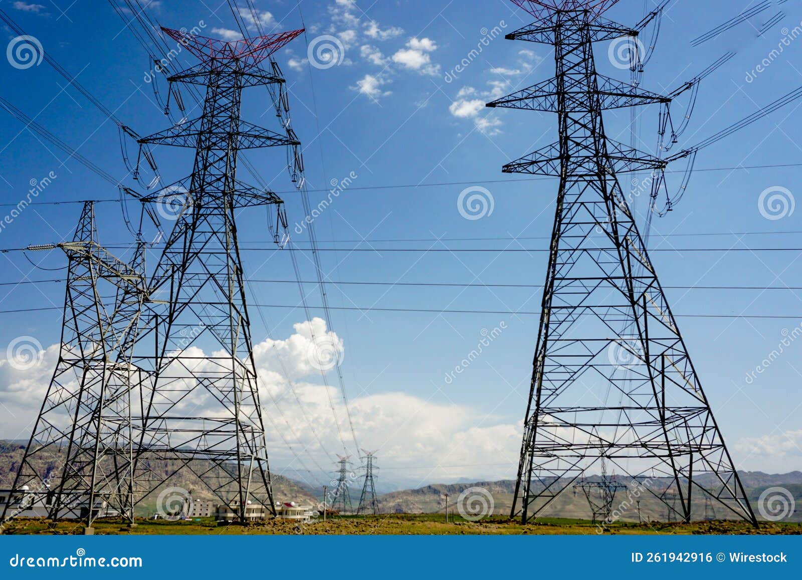 Low Angle View of High Voltage Powerlines on the Field Stock ...
