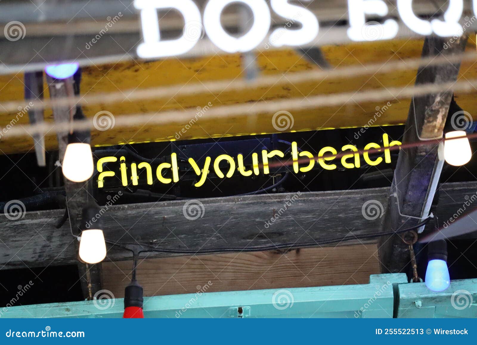 Low-angle View of an Illuminated "Find Your Beach" Sign Stock Image ...