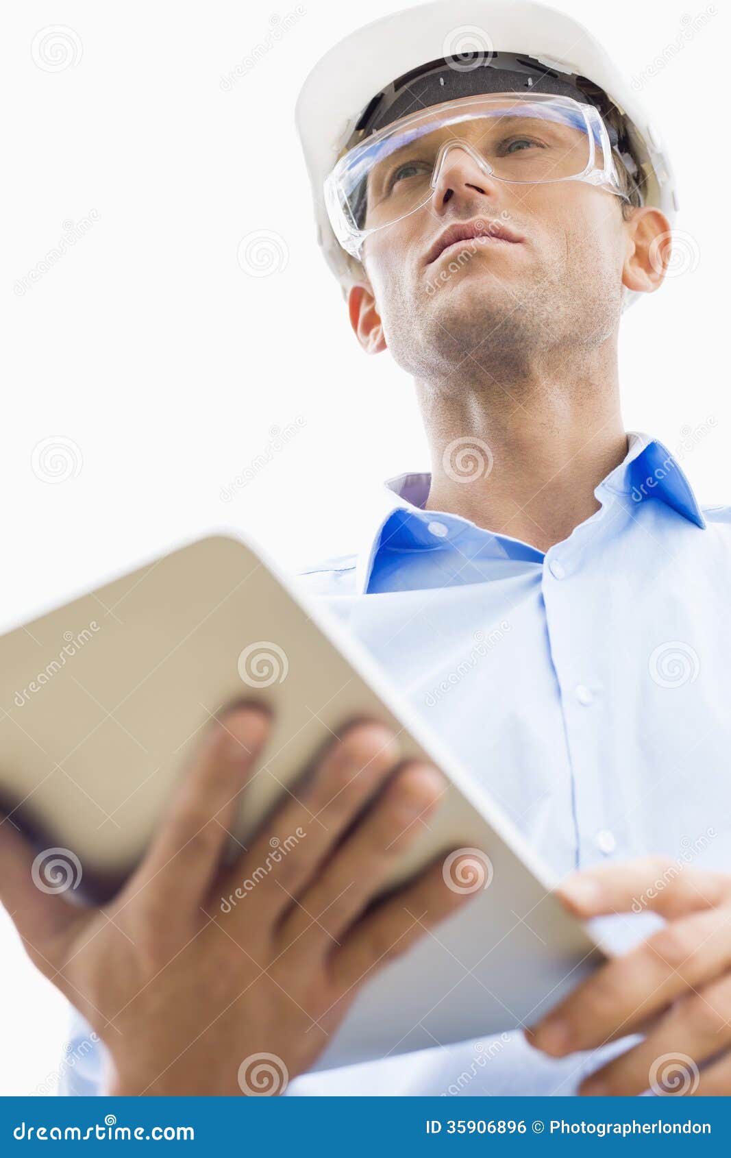 Low Angle View of Male Architect Holding Tablet PC Against Sky Stock ...