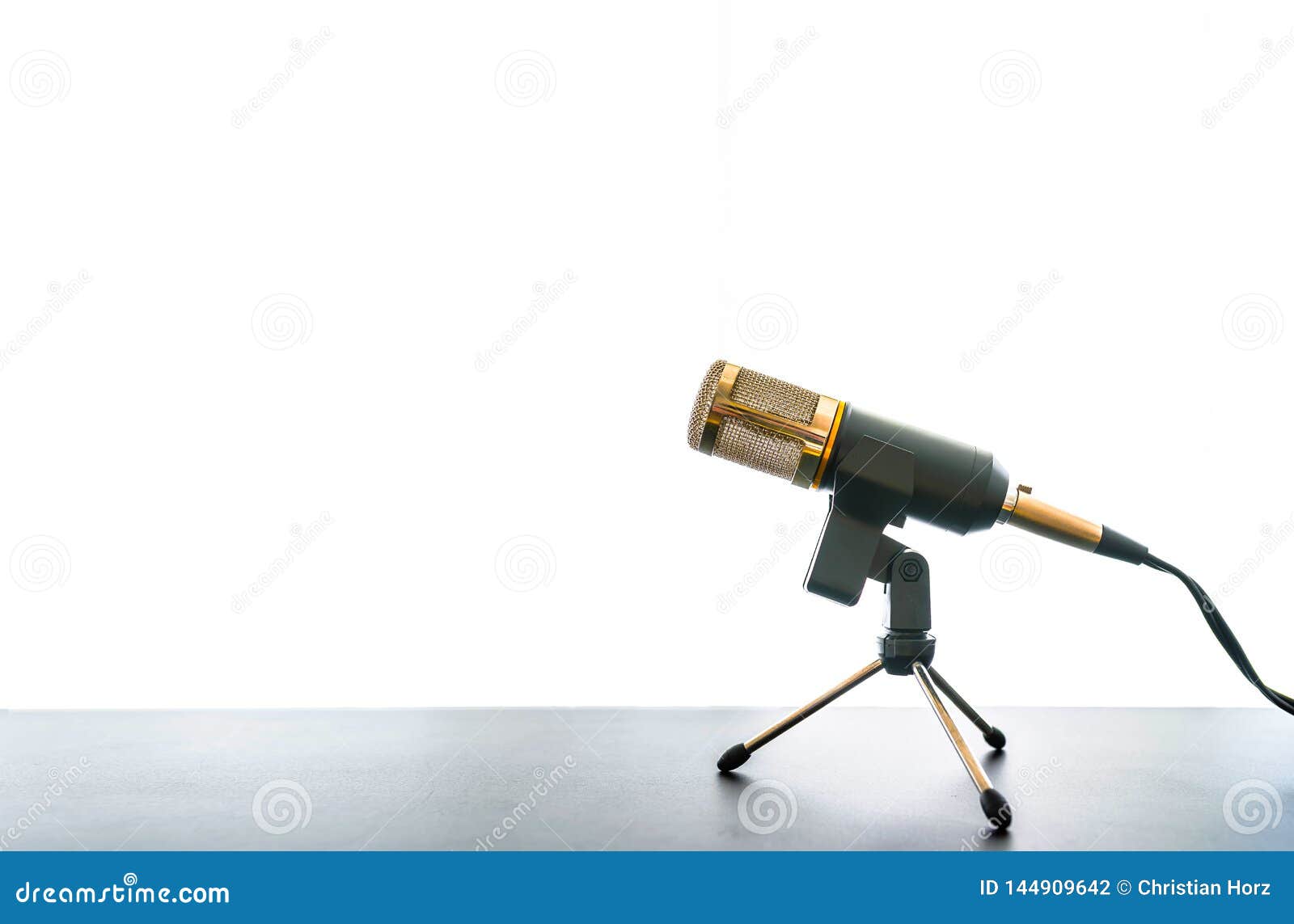 Low Angle View of Microphone on Table Against White Background Stock ...
