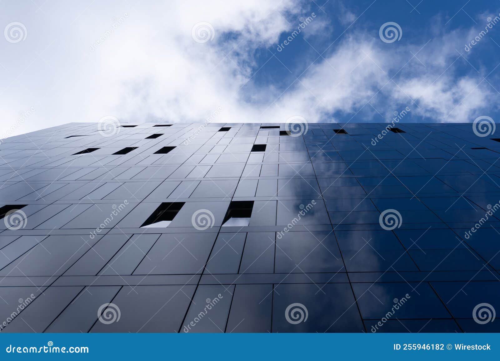 Low-angle View of a Modern Building with Reflective Windows Stock Photo ...
