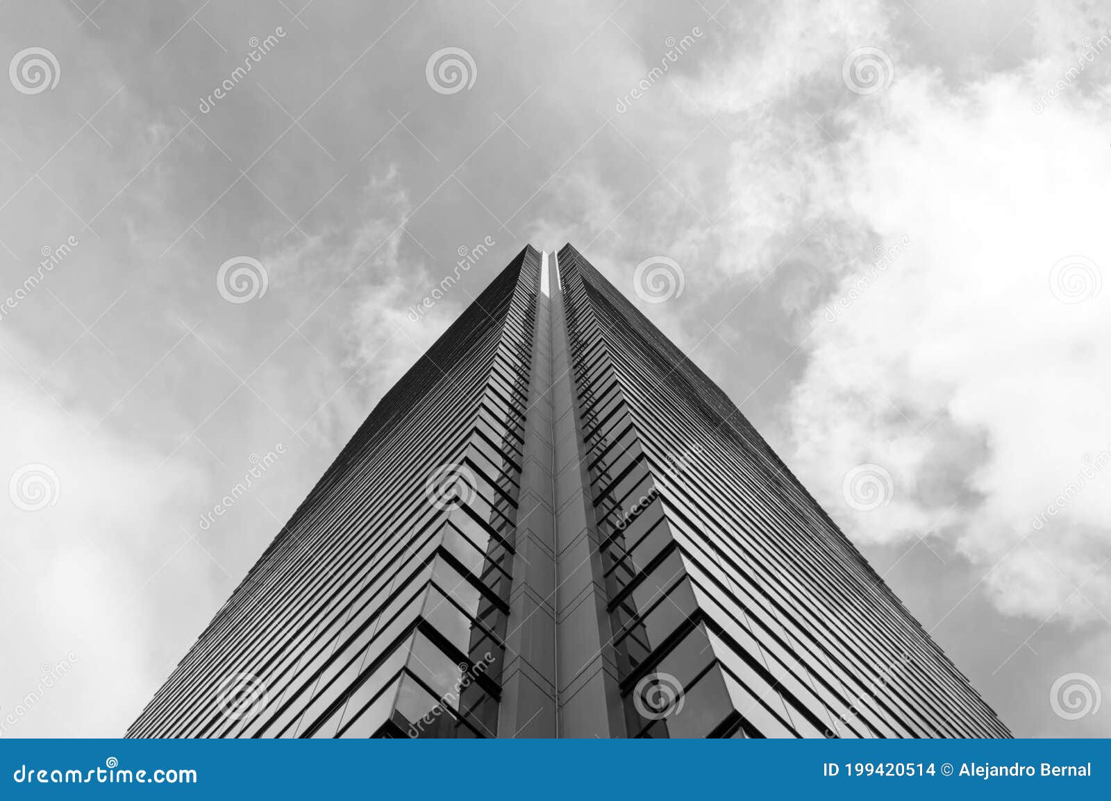 Low Angle View of a Modern Skyscraper Corner with Cloudy Sky at ...