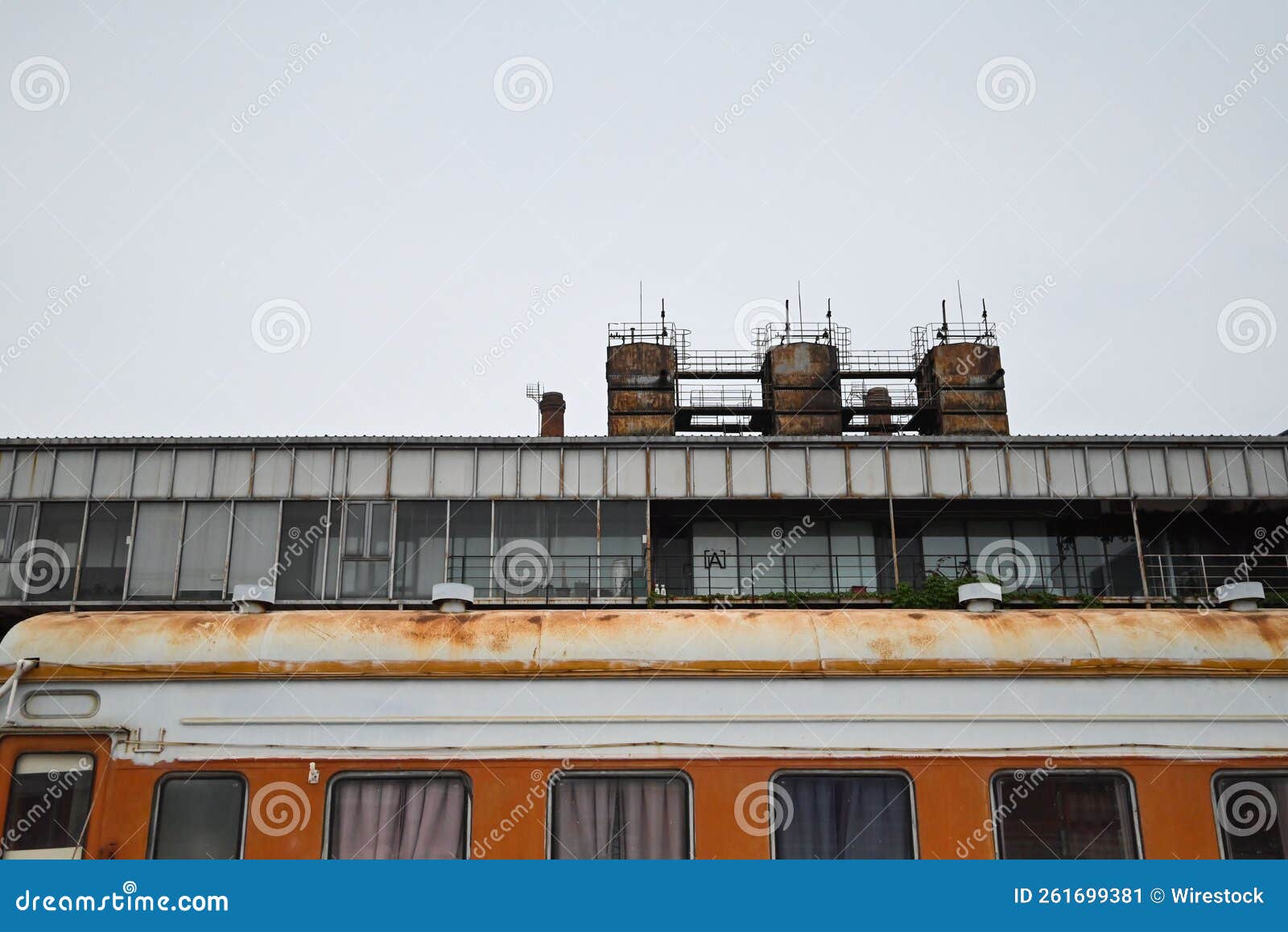Low-angle View of an Old Bus before the Abandoned Factory Building ...
