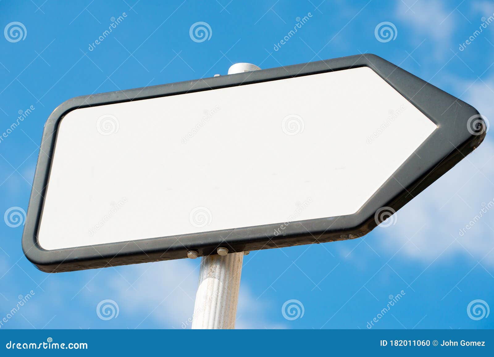 Blank Direction Road Sign Against a Blue Sky. Stock Photo - Image of ...