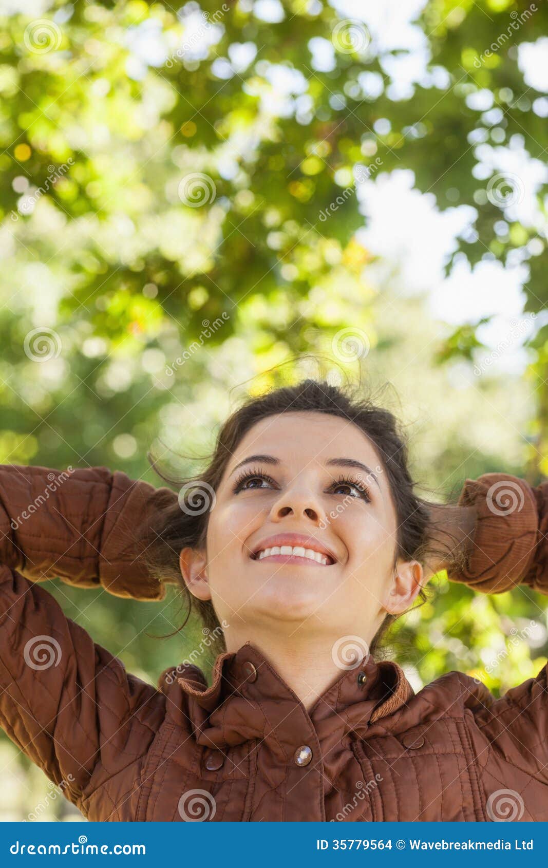 Low Angle View of Pretty Woman Posing in a Park Stock Photo - Image of ...