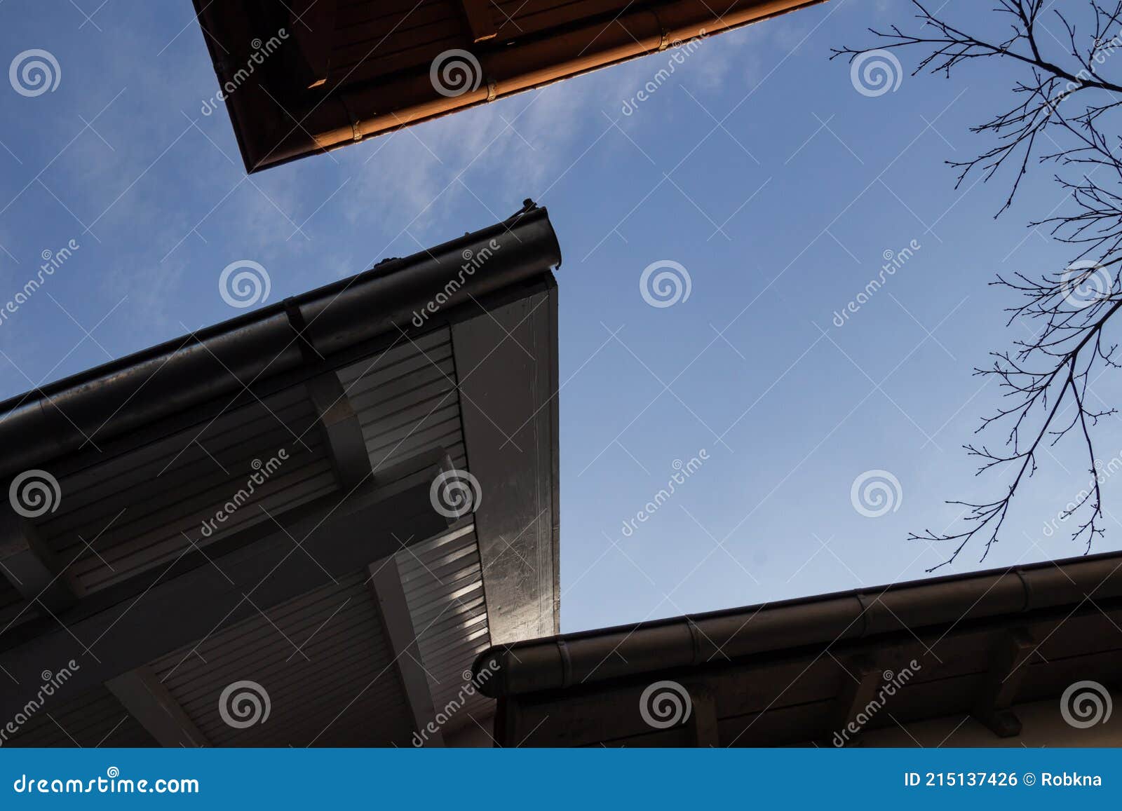 Low Angle View of Roof Rain Gutter Against Blue Sky Stock Photo - Image ...