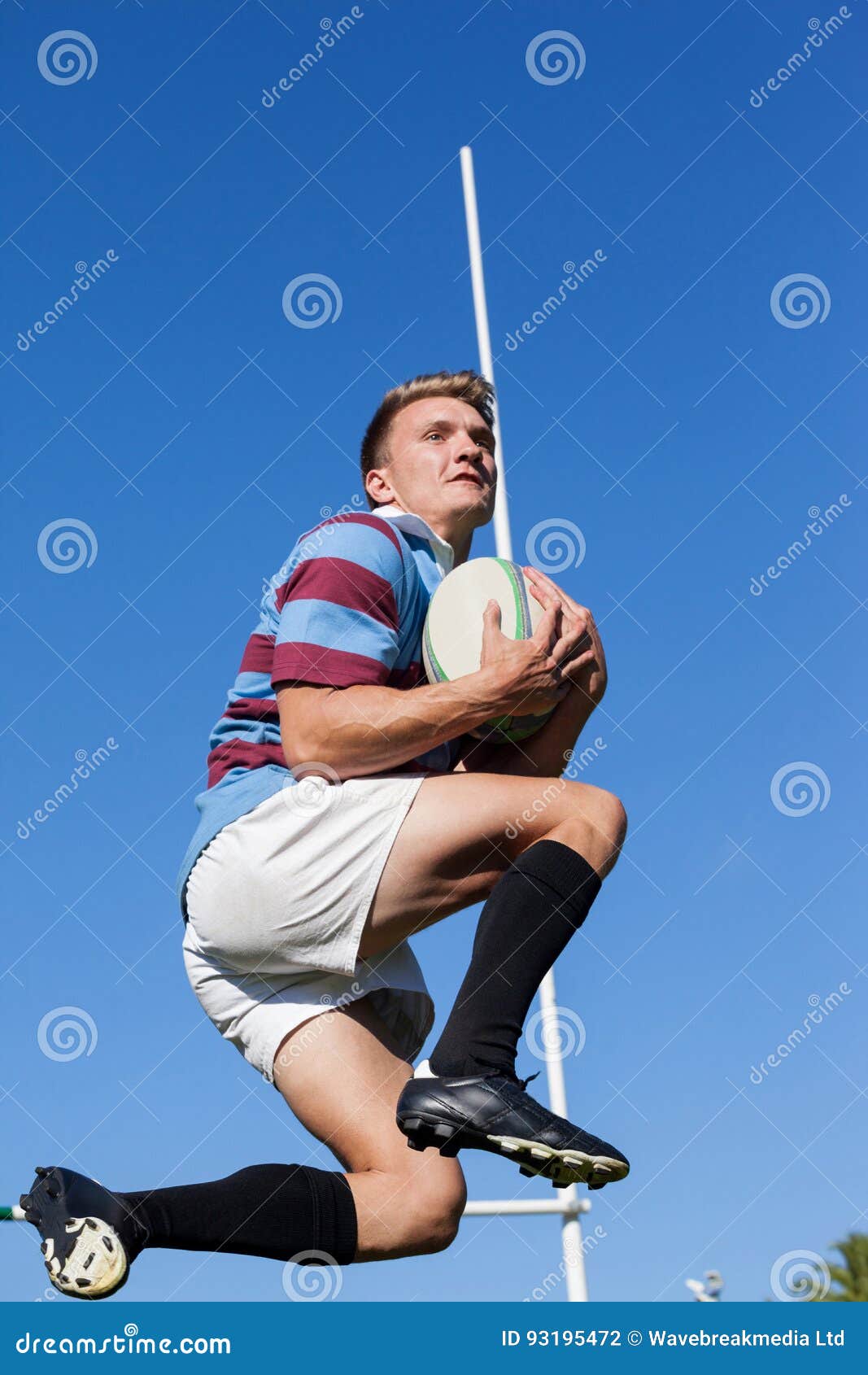 Low Angle View of Rugby Player Catching Ball Stock Photo - Image of ...
