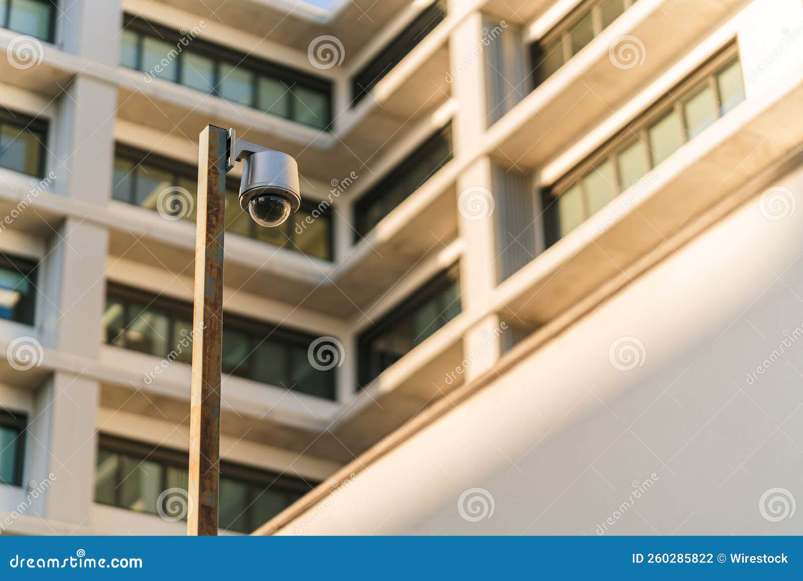 Low-angle View of a Security Camera Column by a Residential Building ...