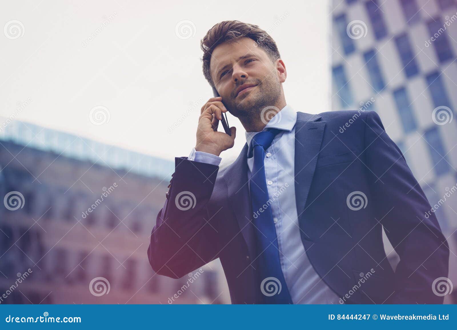 Low Angle View of Smart Businessman Talking on Mobile Phone Stock Image ...