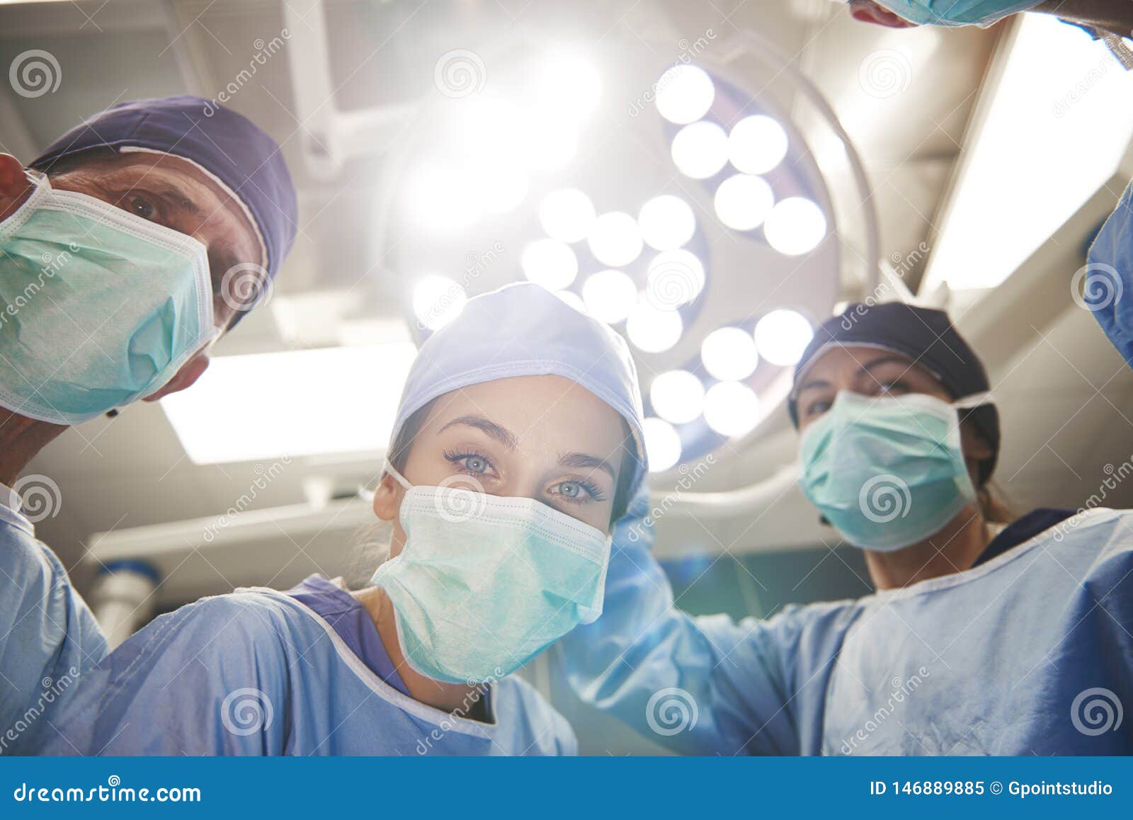 Low Angle View of Surgeons Over the Operating Table Stock Image - Image ...