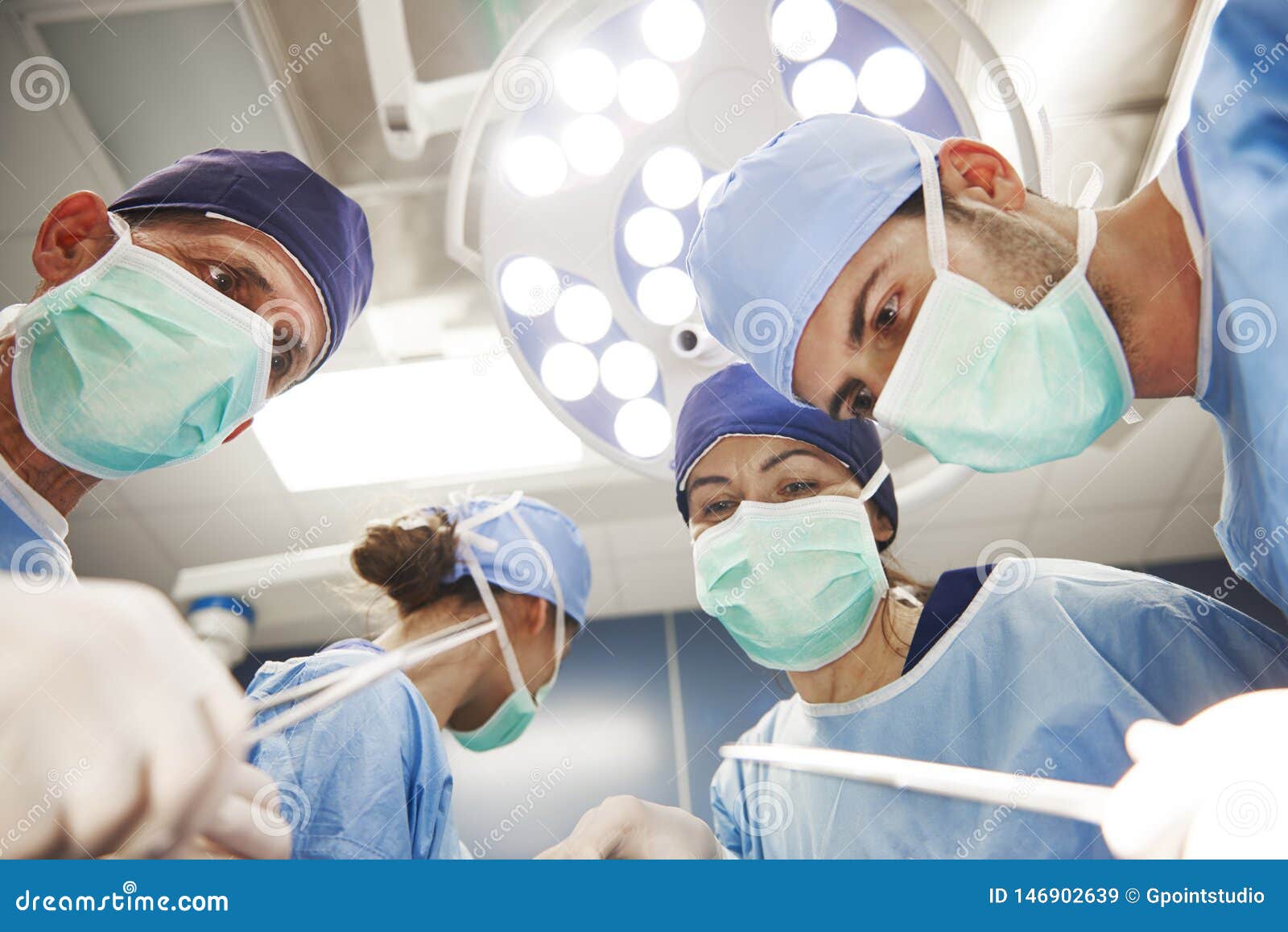 Low Angle View of Surgeons Over the Operating Table Stock Image - Image ...