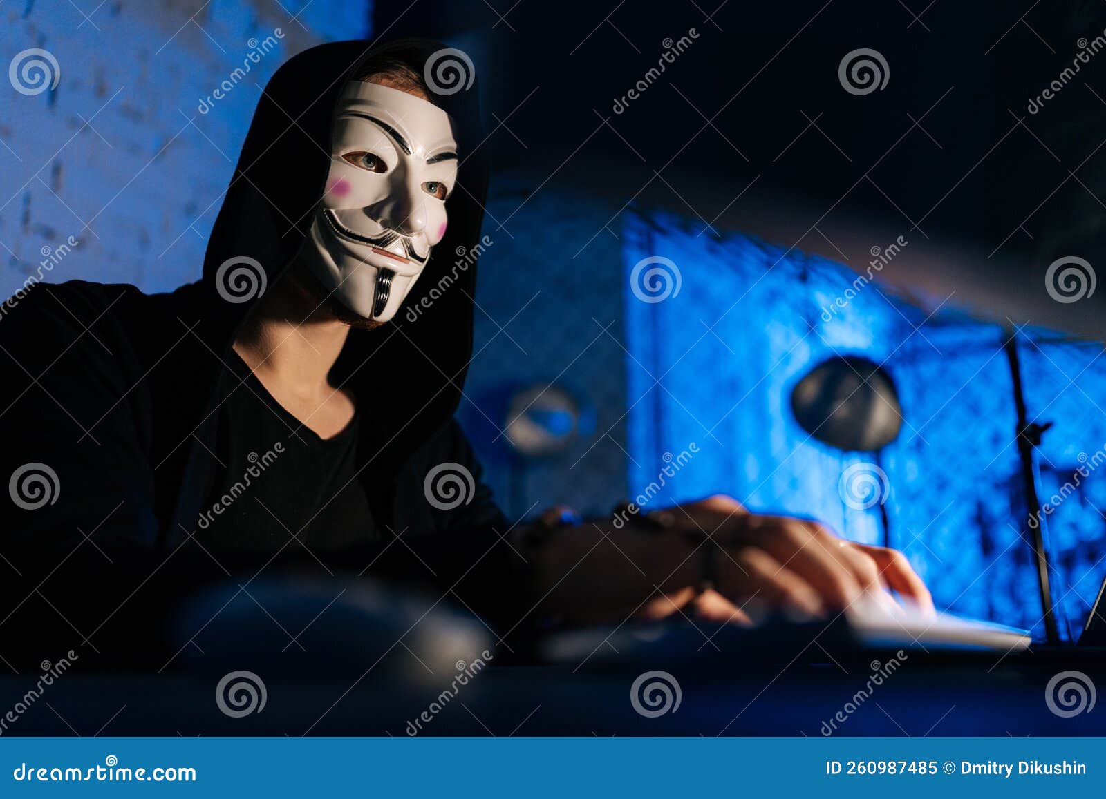 Low-angle View of Unrecognizable Wanted Hacker Male Wearing Anonymous ...
