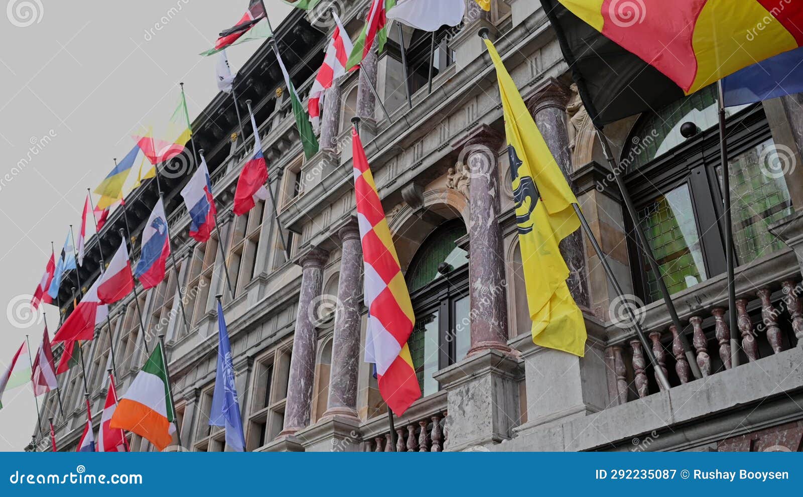 Low Angle View of Variety of Flags Seen Waving in Wind Stock Video ...