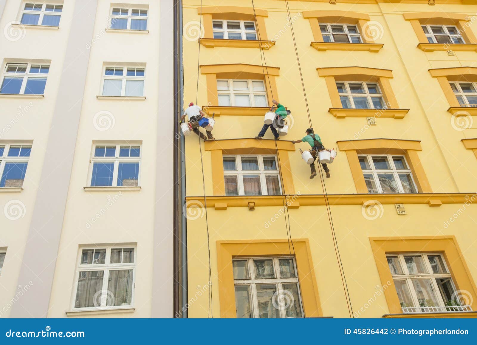 Low Angle View of Window Washers Hanging Outside Building Editorial ...