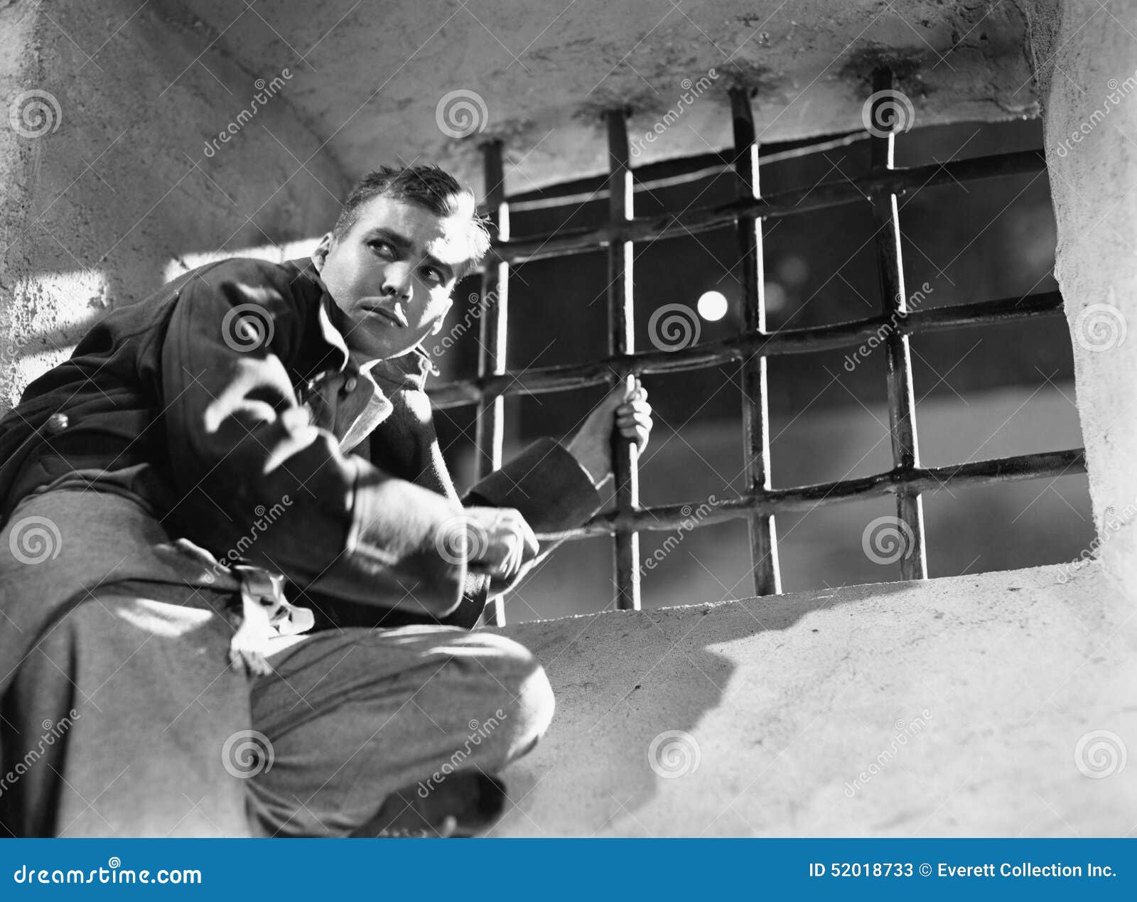 Low Angle View of a Young Man Trying To Escape from a Prison Cell Stock ...