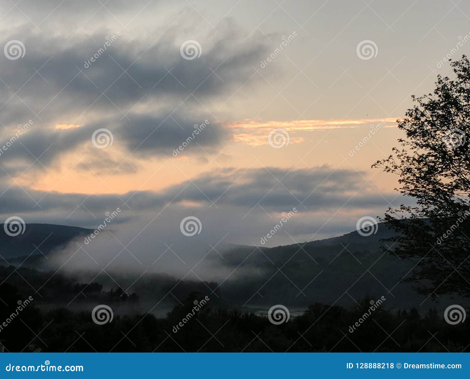 Low cloud sunset stock photo. Image of sunset, water - 128888218