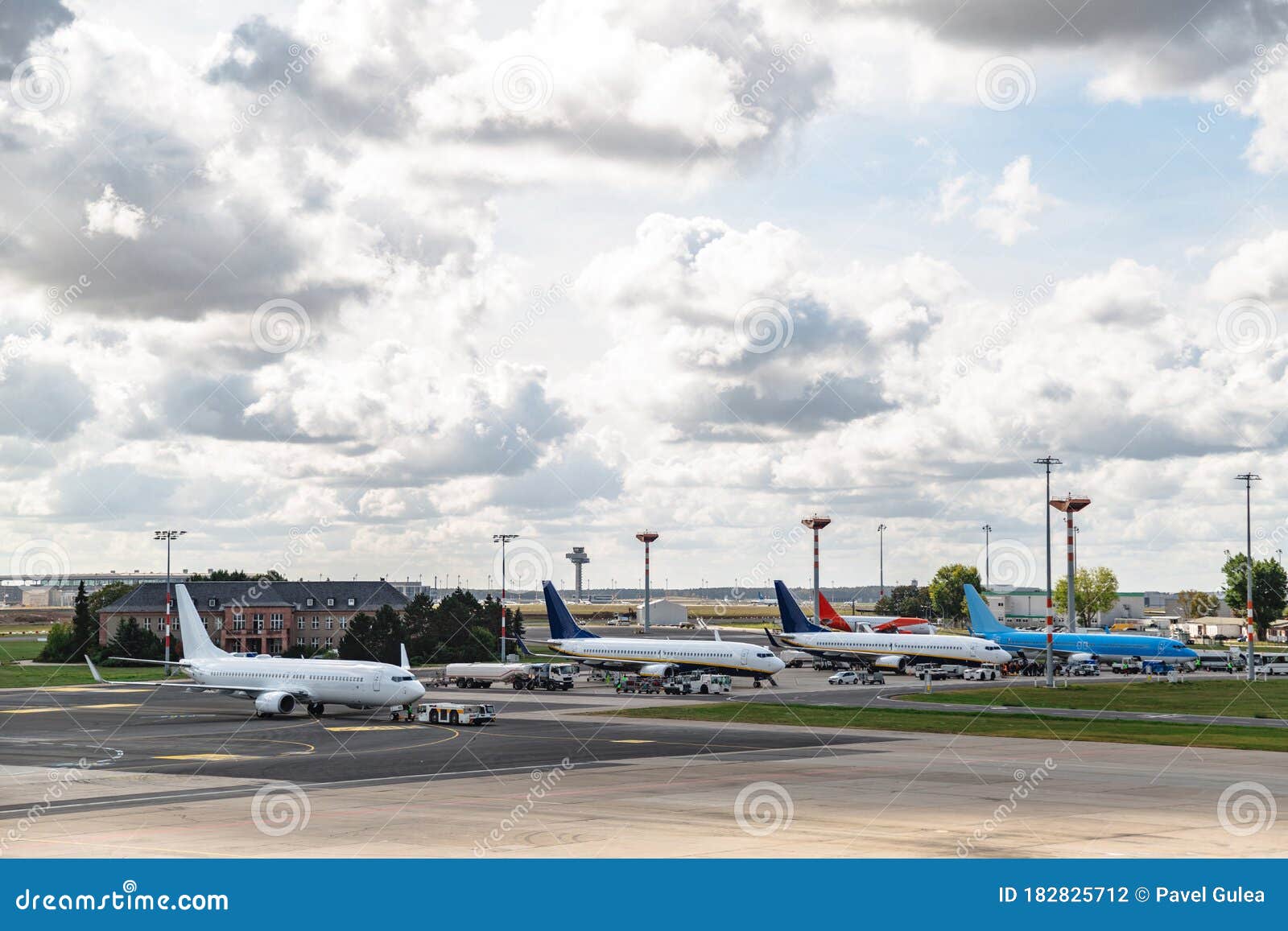 Low-cost Airplanes Queue for Loading on Airfield Editorial Photography ...