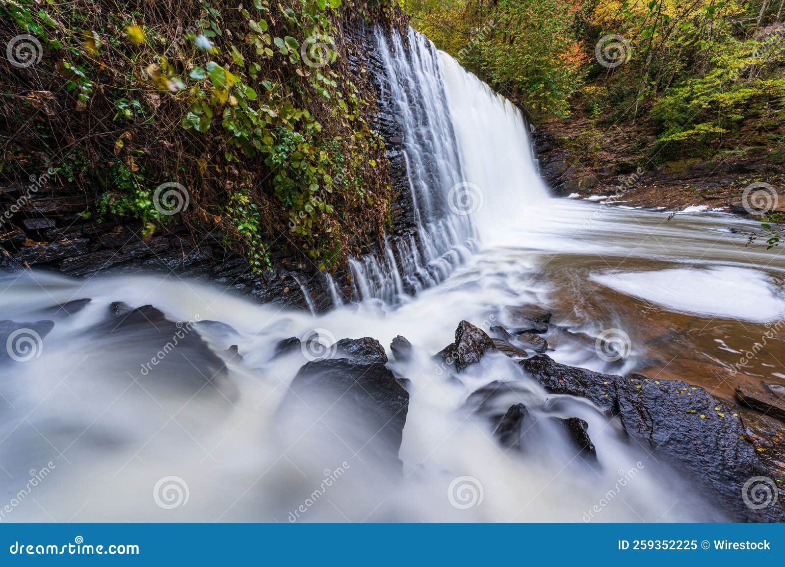 Low Exposure of a Waterfall Flowing Down the Rocks. Stock Image - Image ...