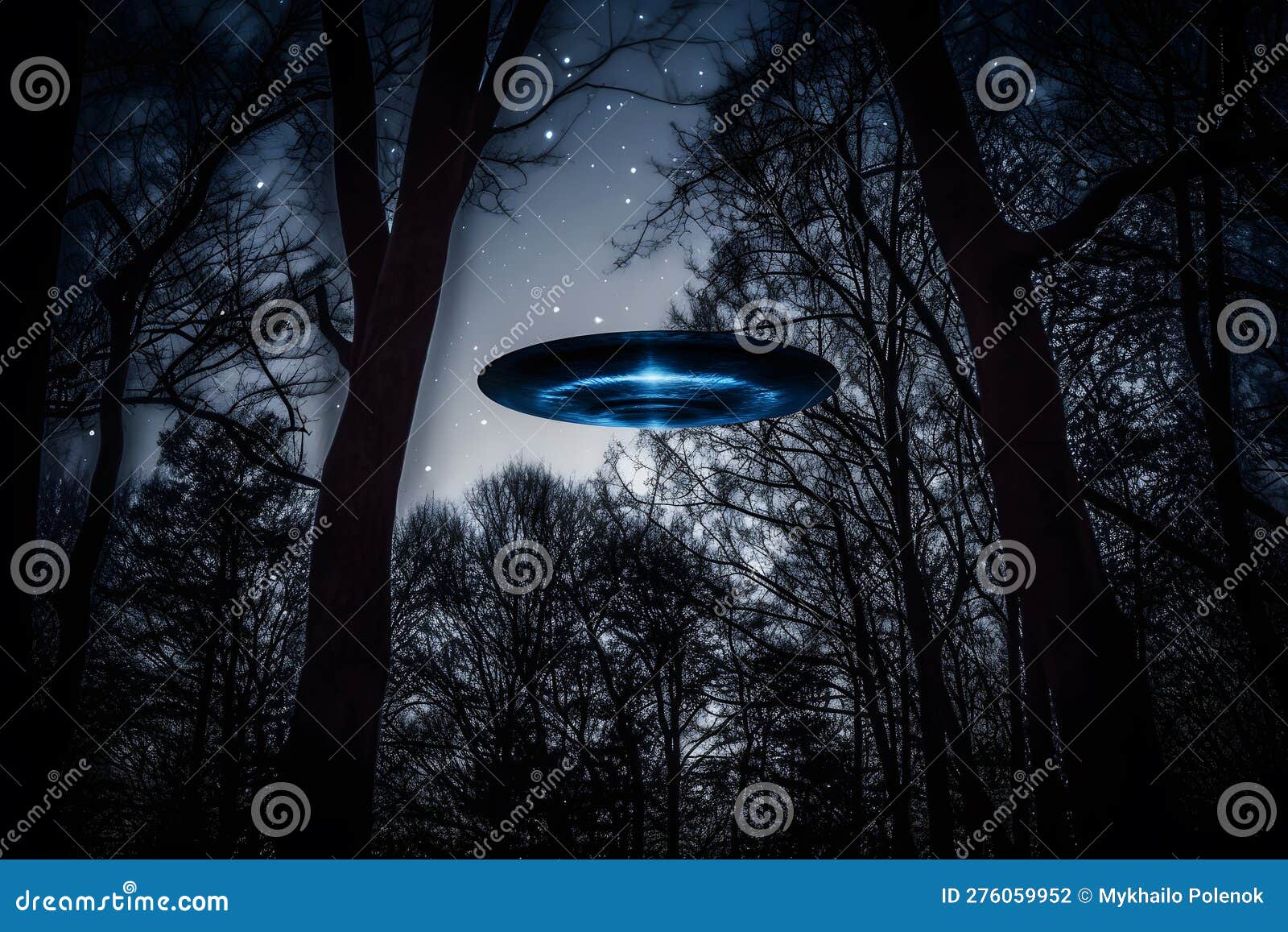Low Key Image of UFO Hovering Over a Forest at Night with Light Beam ...