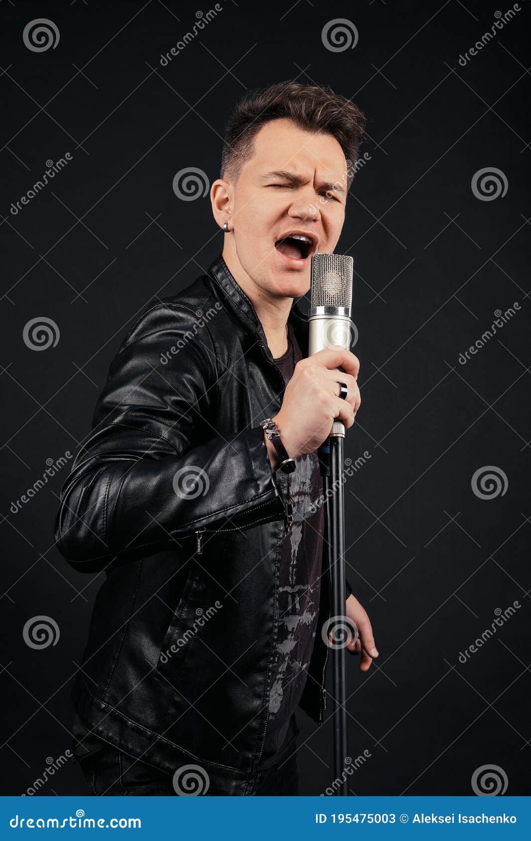 Low Key Portrait of Man Singing and Holding Microphone Stock Image ...