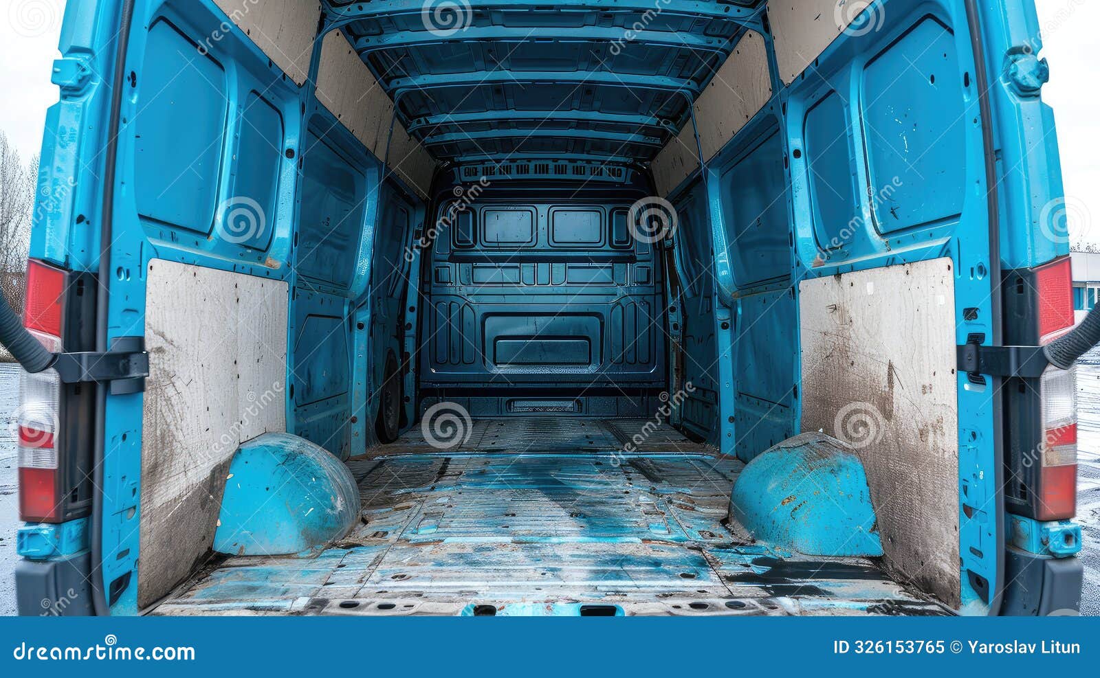 A Low Rear View of the Open Back Doors and Trunk Area Inside an Empty ...