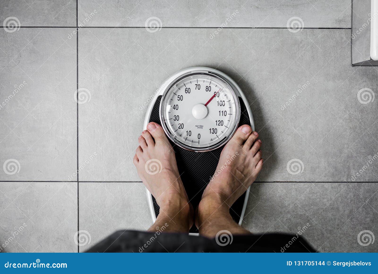 Low Section of Man Standing on Weight Scale Stock Photo - Image of feet ...