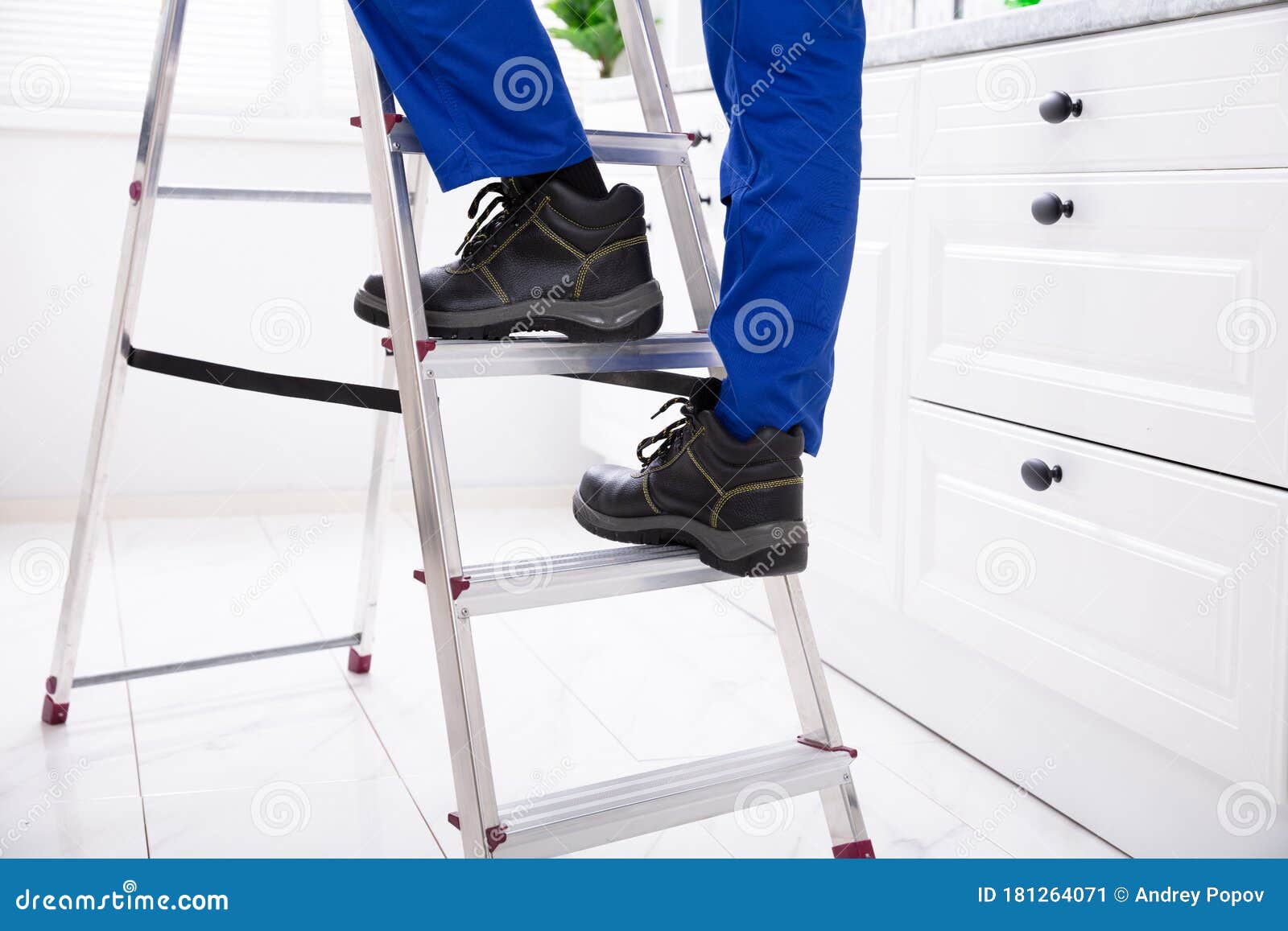 Man Stepping on Ladder stock image. Image of dangerous - 181264071