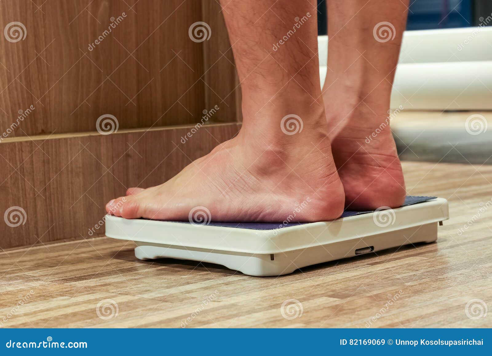 Low Section of People Standing on Weighing Scale Stock Image - Image of ...