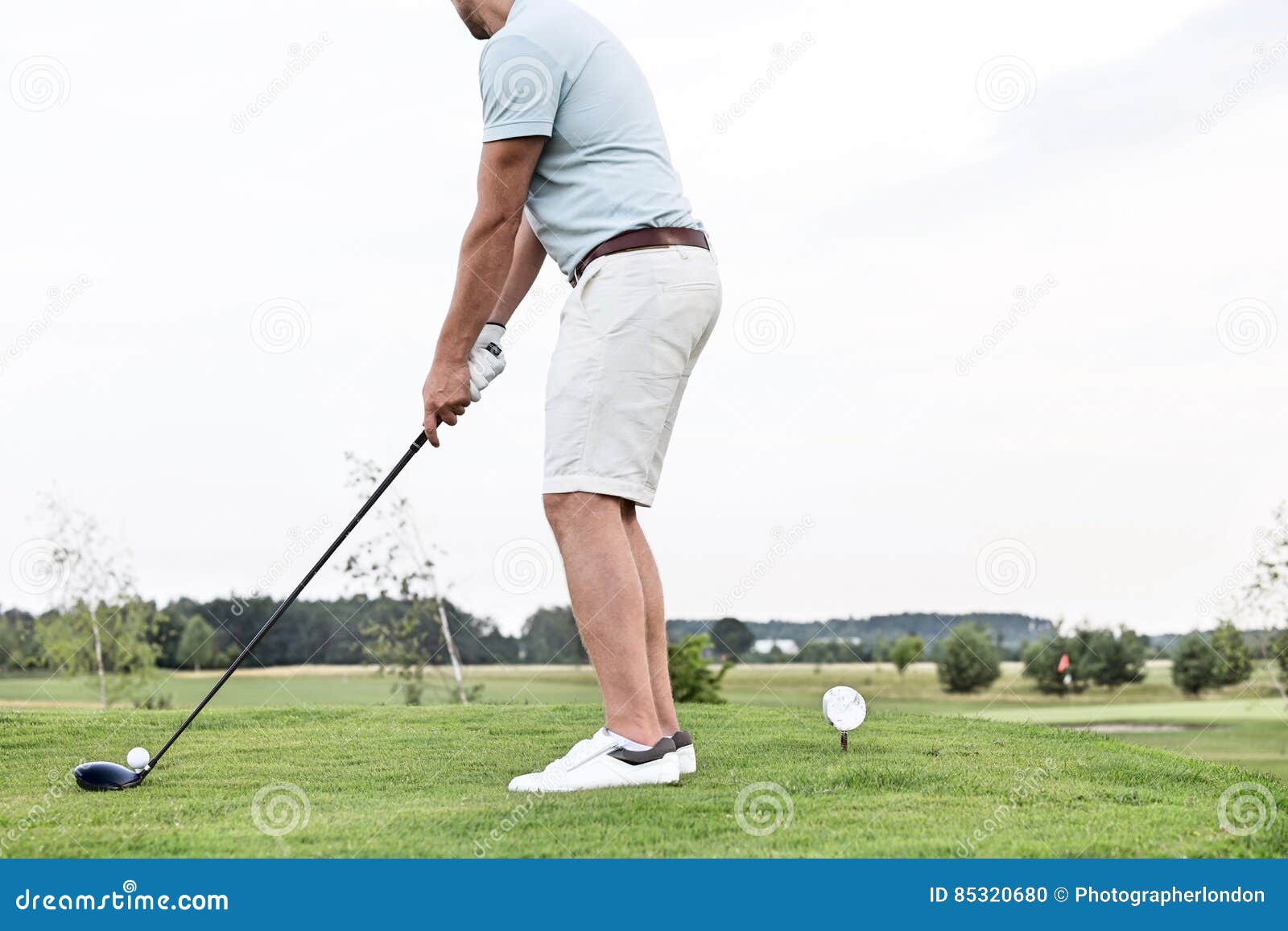 Low Section Side View of Man Playing Golf Against Clear Sky Stock Photo ...