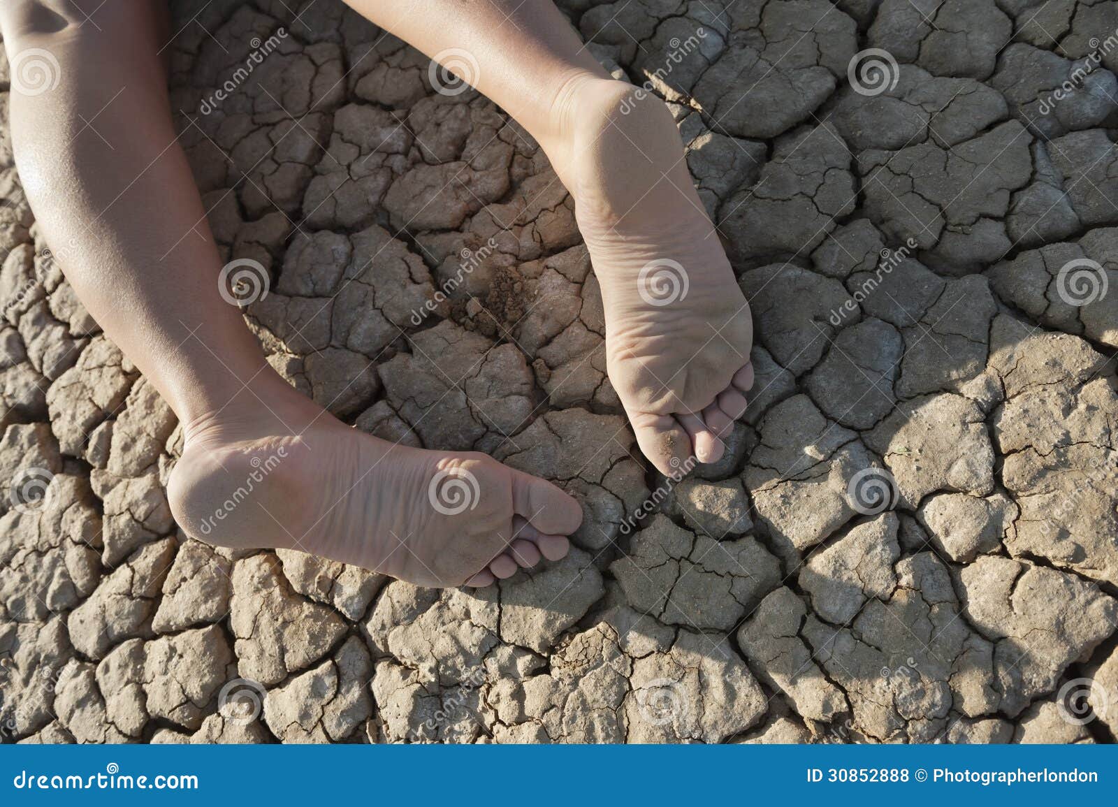 Low Section of a Woman Lying on Cracked Land Stock Photo - Image of ...