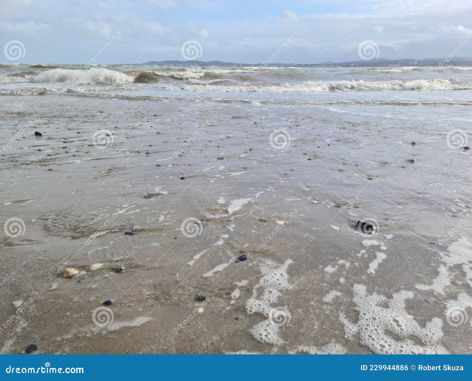 Low tide on the beach stock photo. Image of wave, ocean - 229944886