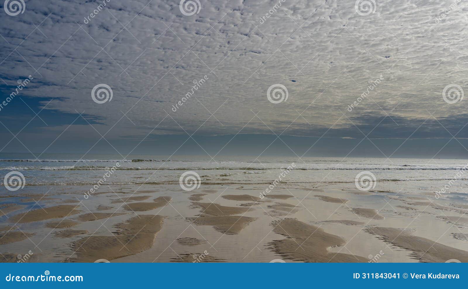 The Low Tide in the Ocean. Rivulets of Water Form a Bizarre Pattern on ...