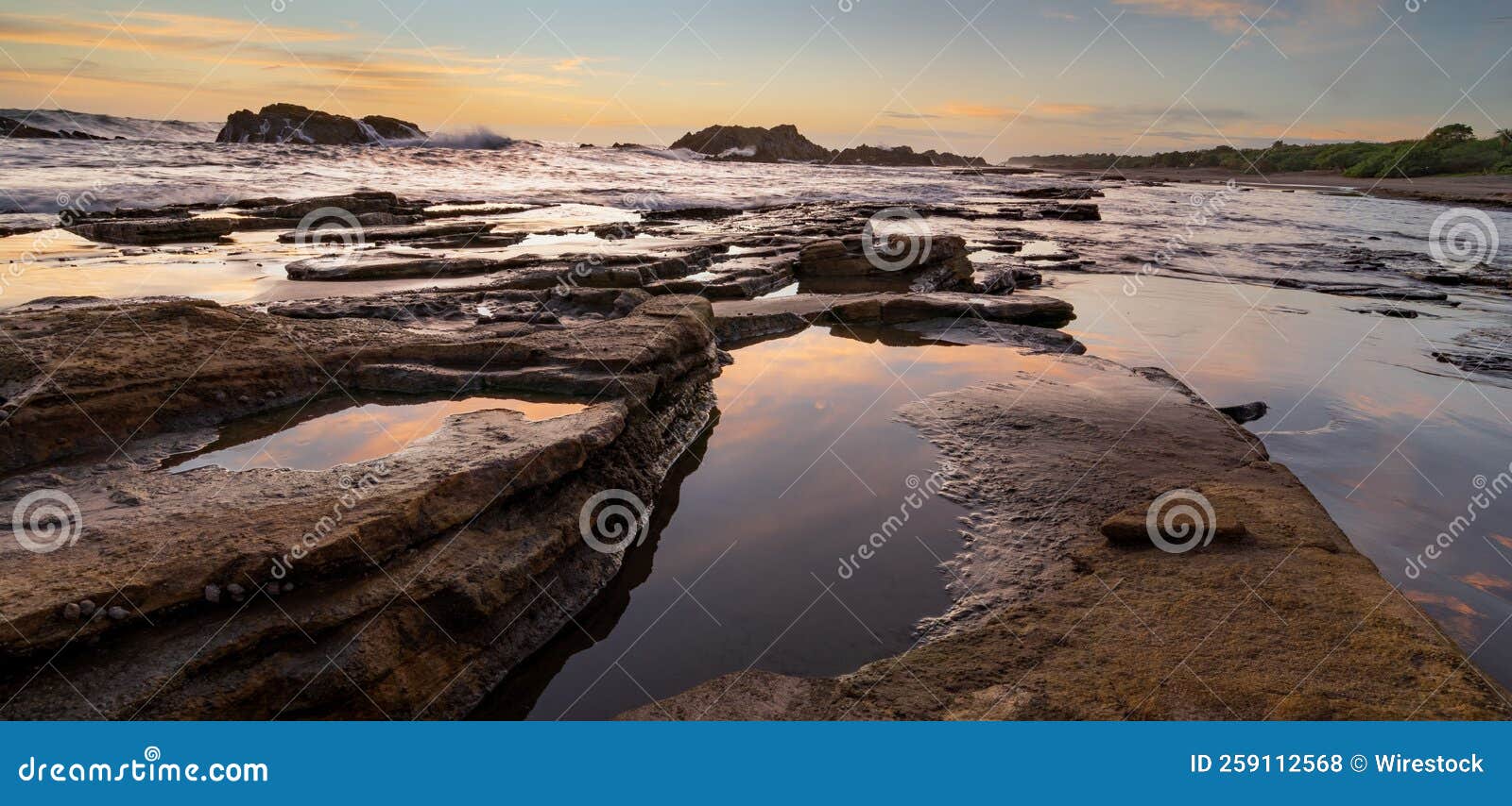 Low Tide on a Rocky Beach with Seascape at Sunset Stock Photo - Image ...