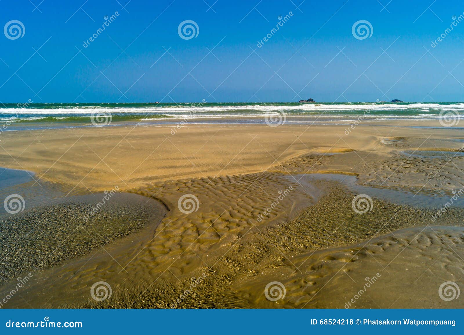 Low tide sand and water . stock photo. Image of flowing - 68524218