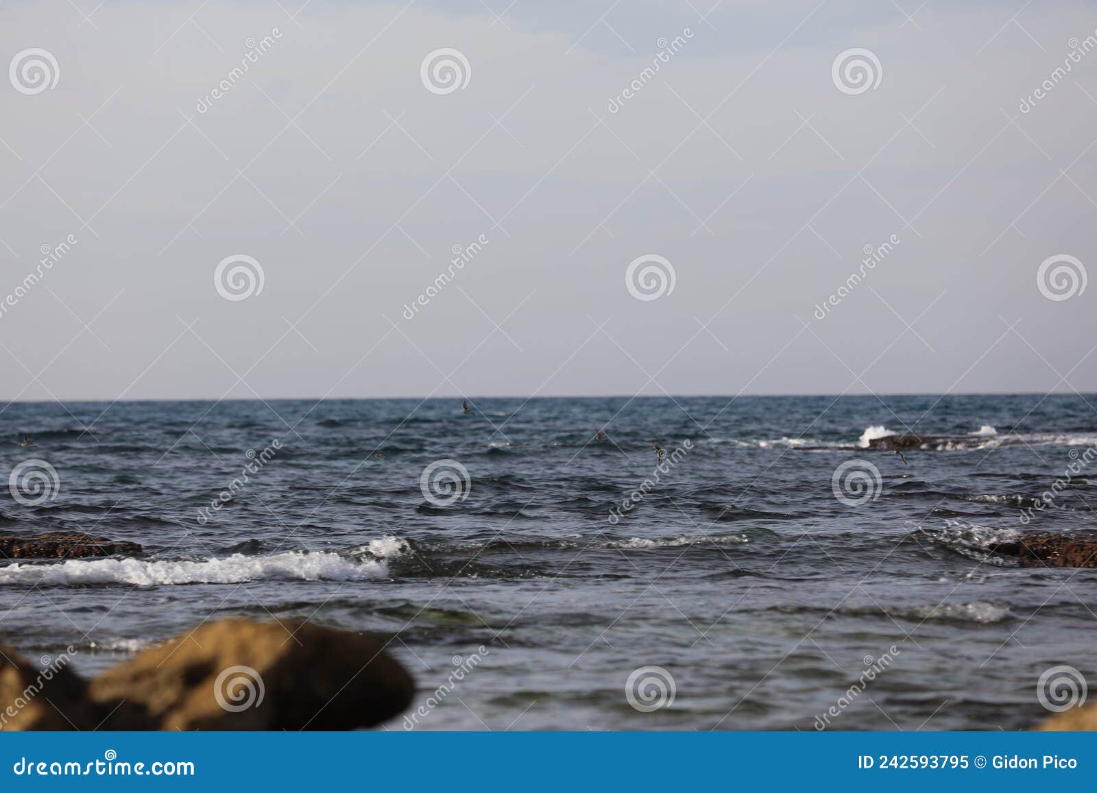Low Waves on the Shore of a Beach High Quality Stock Image - Image of ...