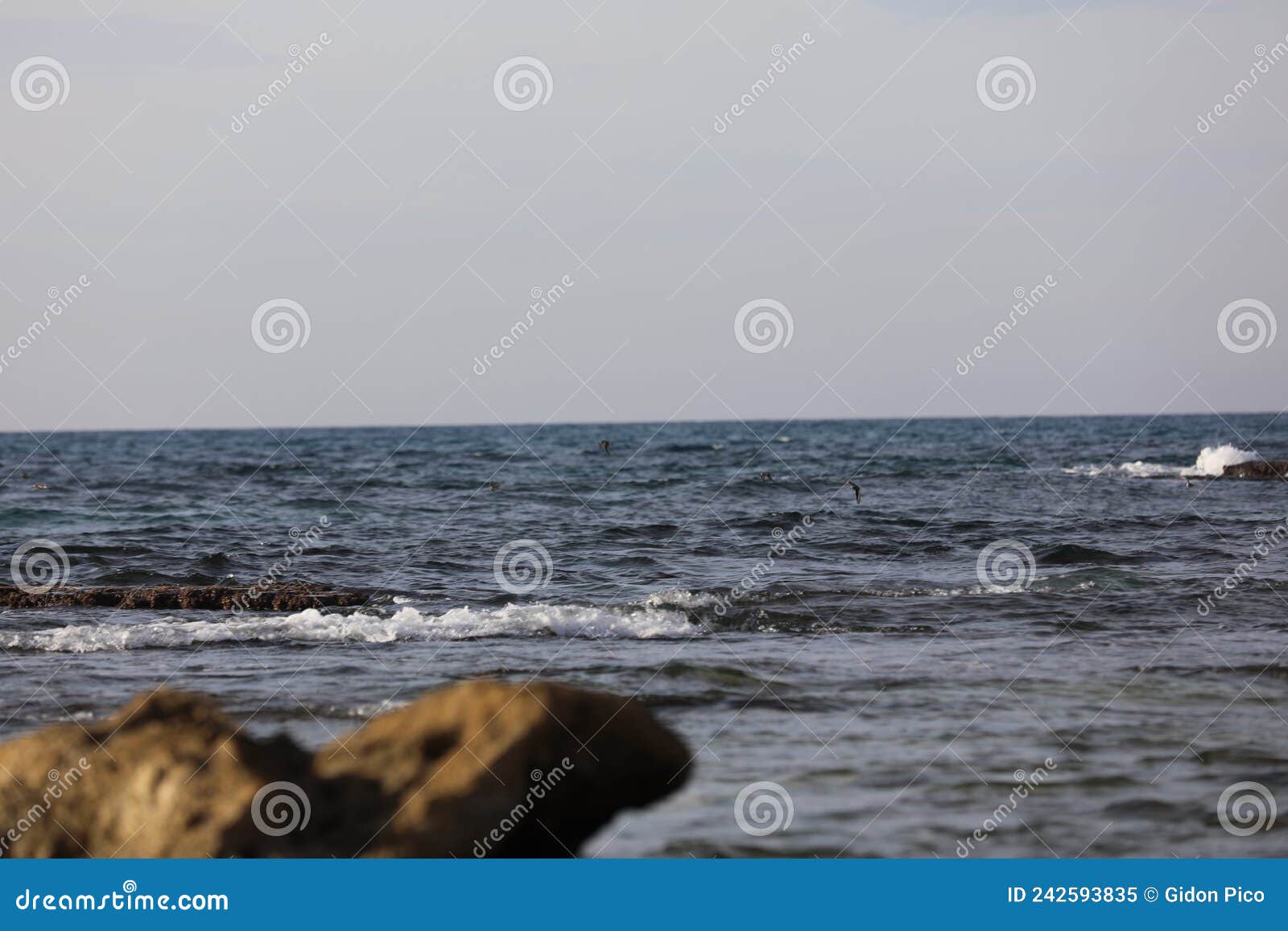 Low Waves on the Shore of a Beach High Quality Stock Image - Image of ...